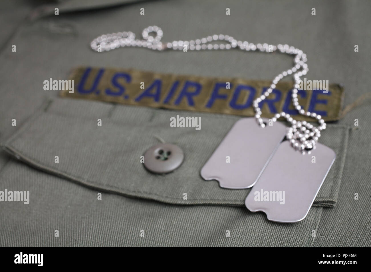 U.S. AIR FORCE Branch Tape with dog tags on olive green uniform ...