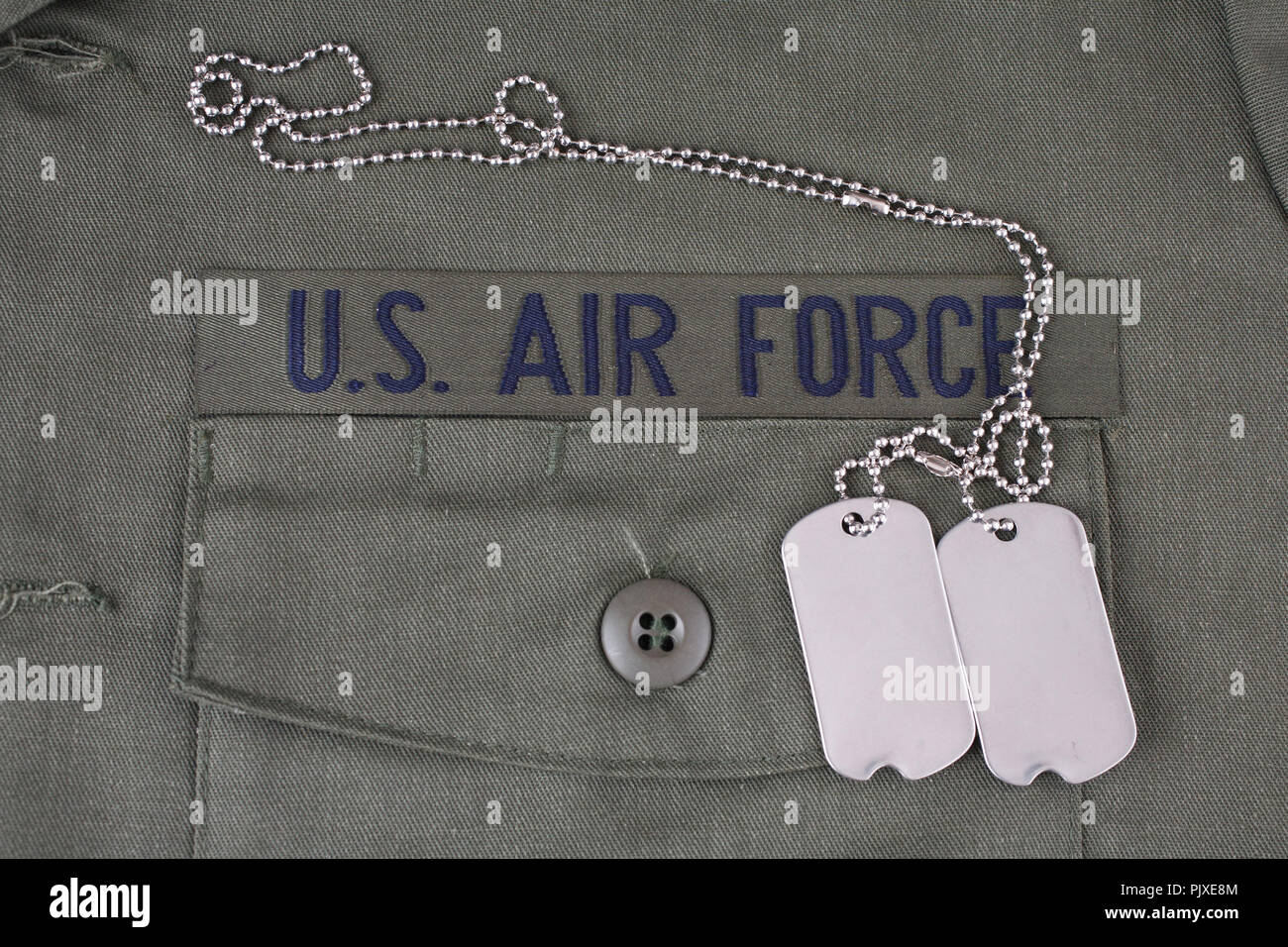 U.S. AIR FORCE Branch Tape with dog tags on olive green uniform ...