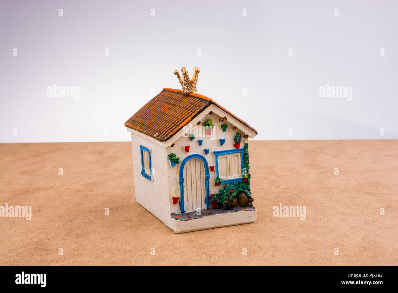 Little model house on a color background in the view Stock Photo - Alamy