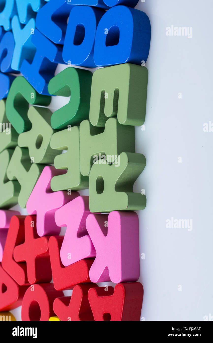 Colorful alphabet letter blocks scattered randomly on white background ...
