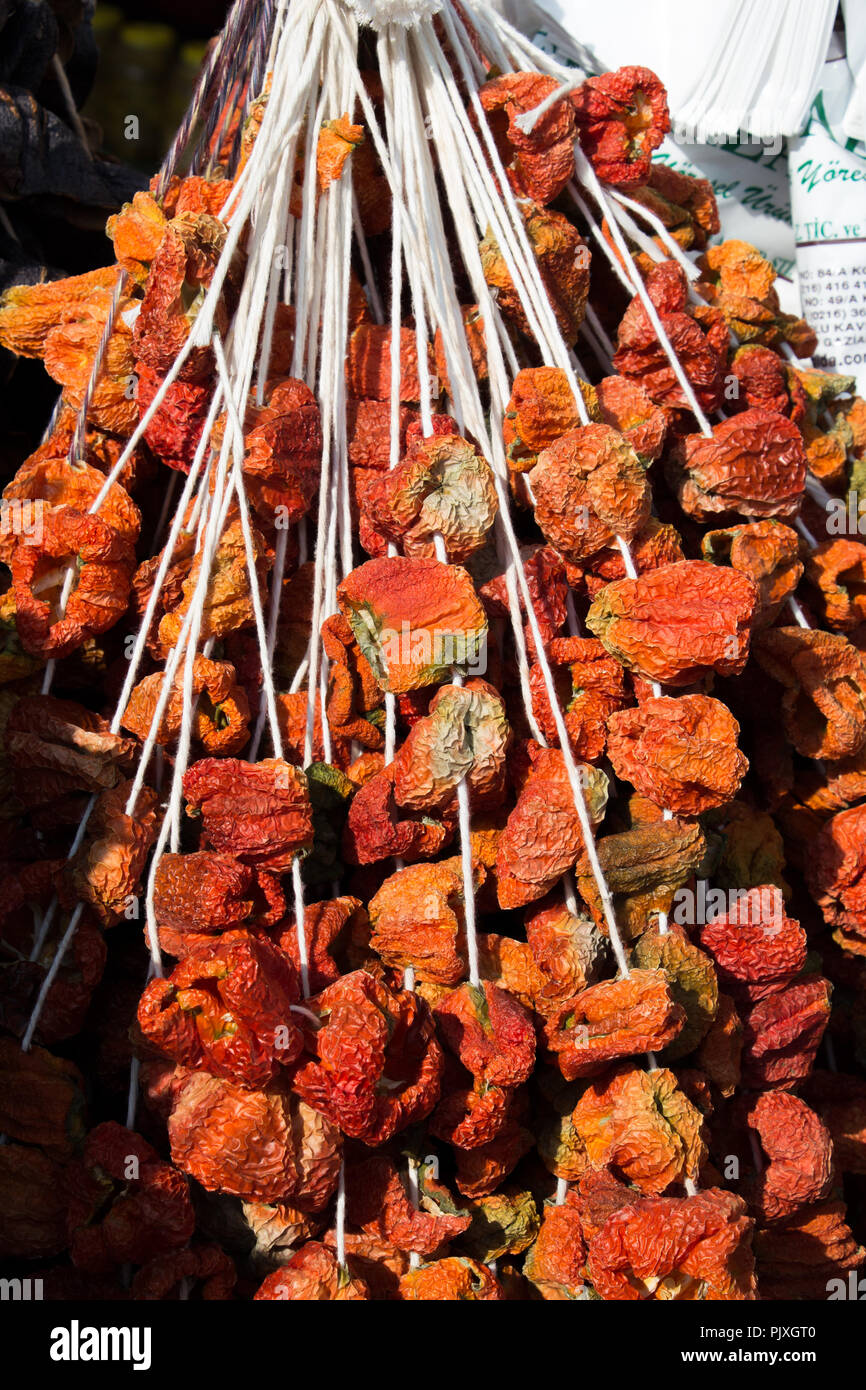 Bundles of red peppers dry in the sun Stock Photo - Alamy