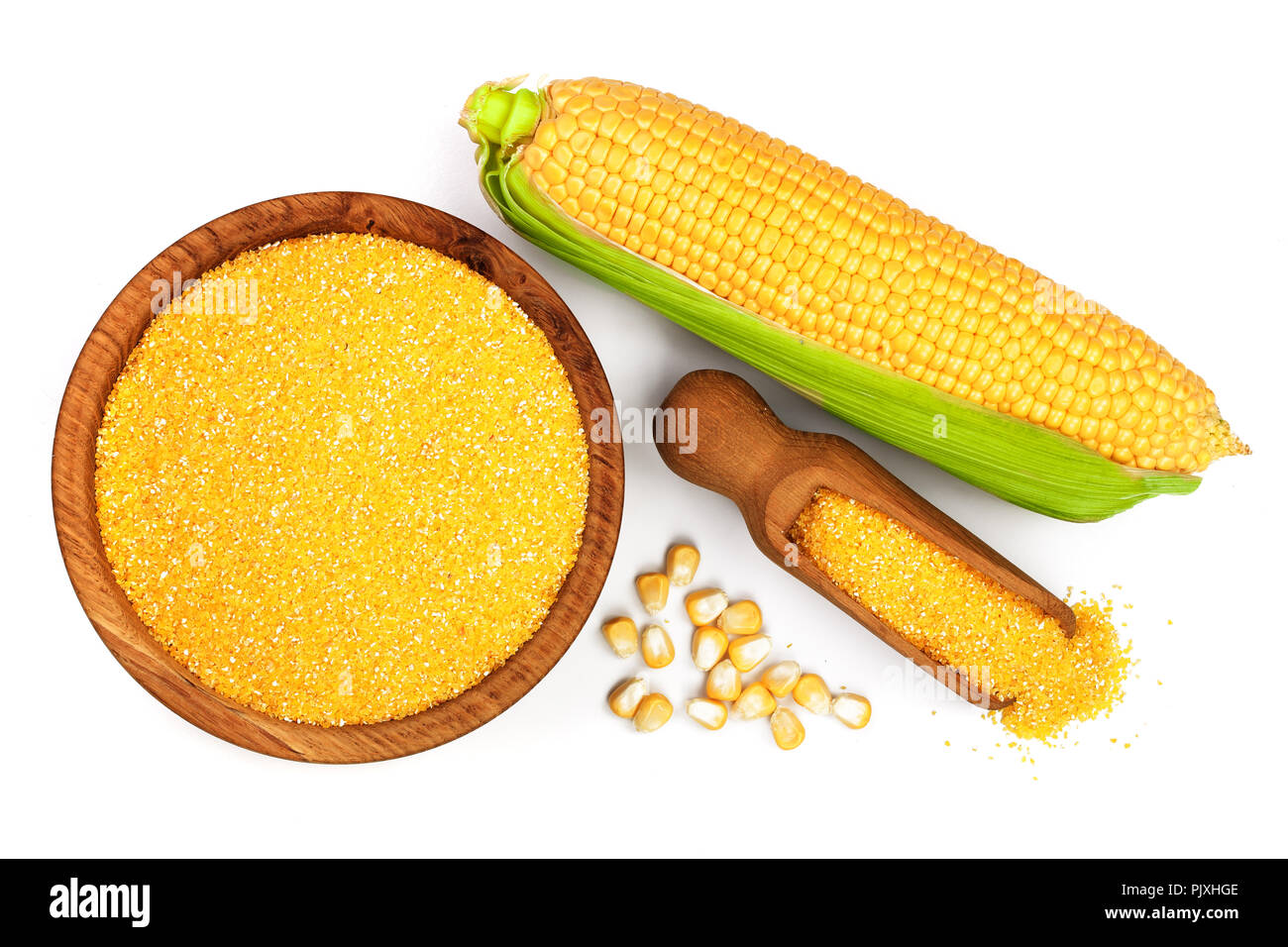 corn groats or cornmeal in wooden bowl and corncob isolated on white ...