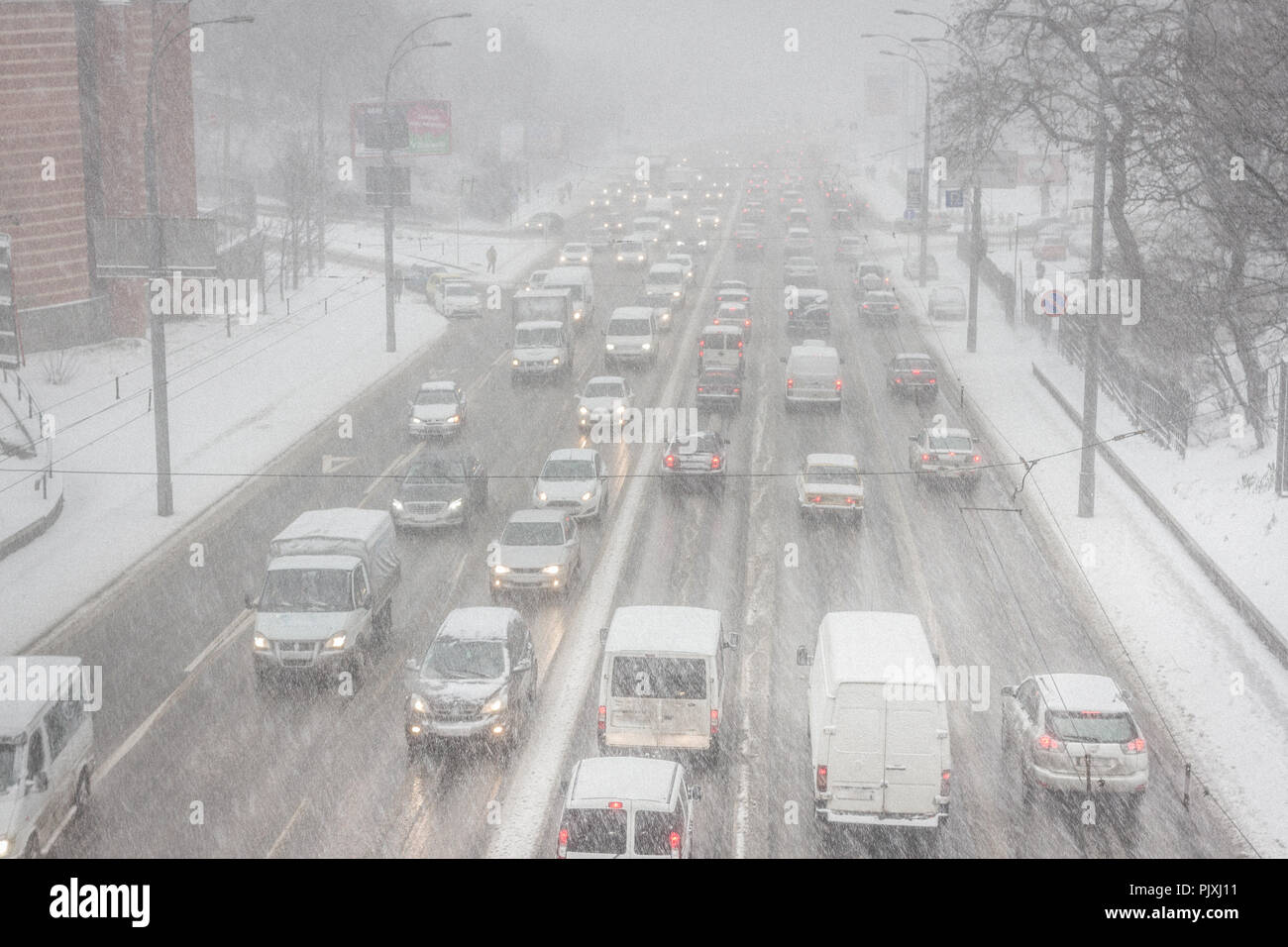 Snow storm on the roads in December in Kiev, Ukraine. Snowy and nothing ...