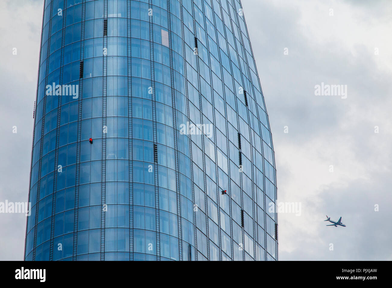 Detail of the Boomerang Building, One Blackfriars with an aeroplane ...
