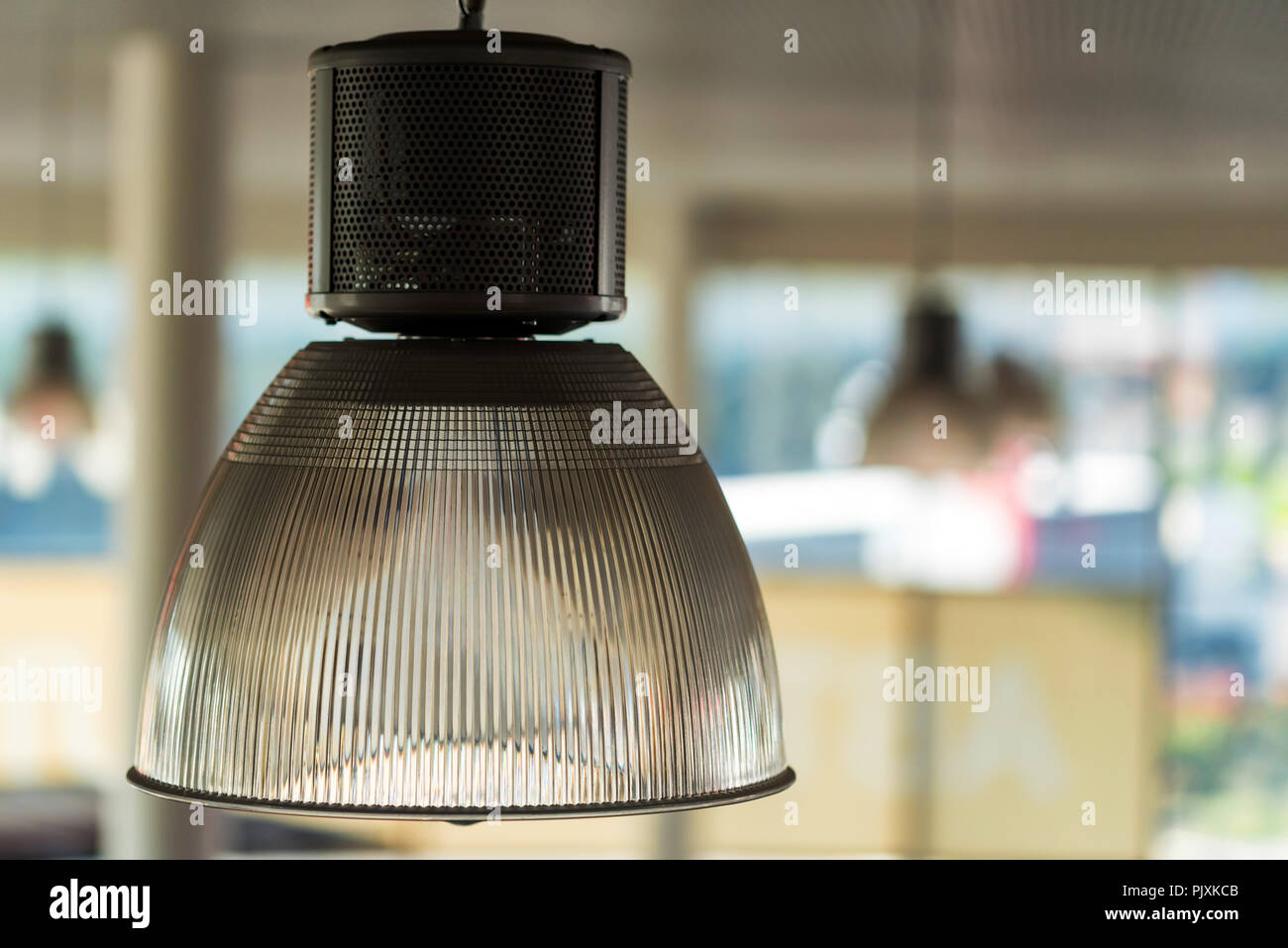 Modern lamp shade on office ceiling close Stock Photo - Alamy