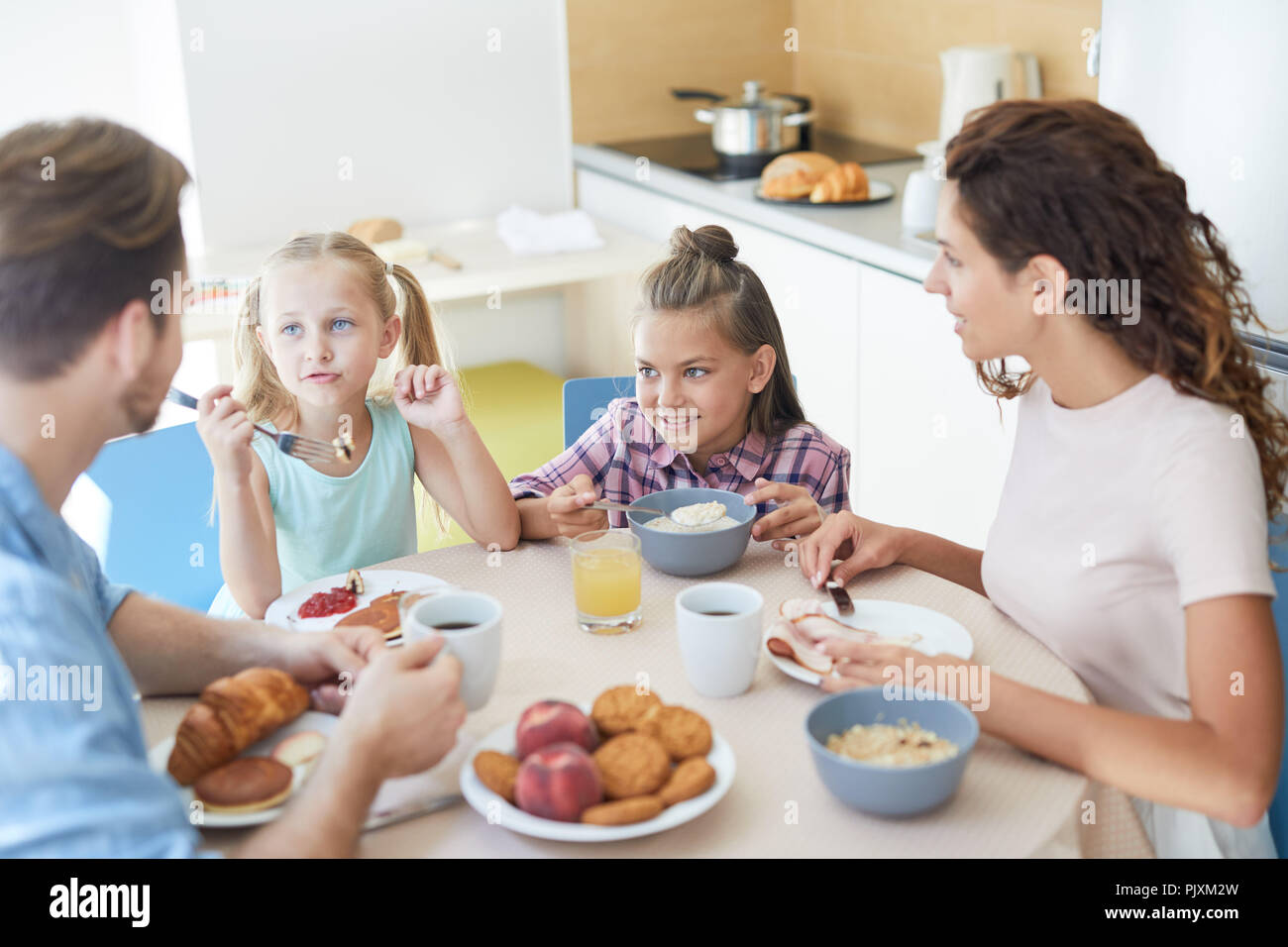 Talking to parents Stock Photo - Alamy