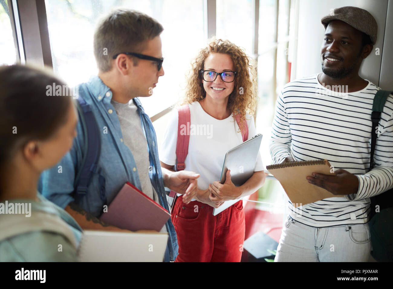 Discussing summer vacations Stock Photo - Alamy