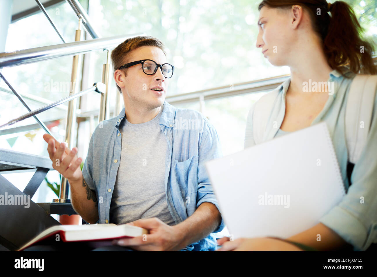 Explaining to groupmate Stock Photo - Alamy