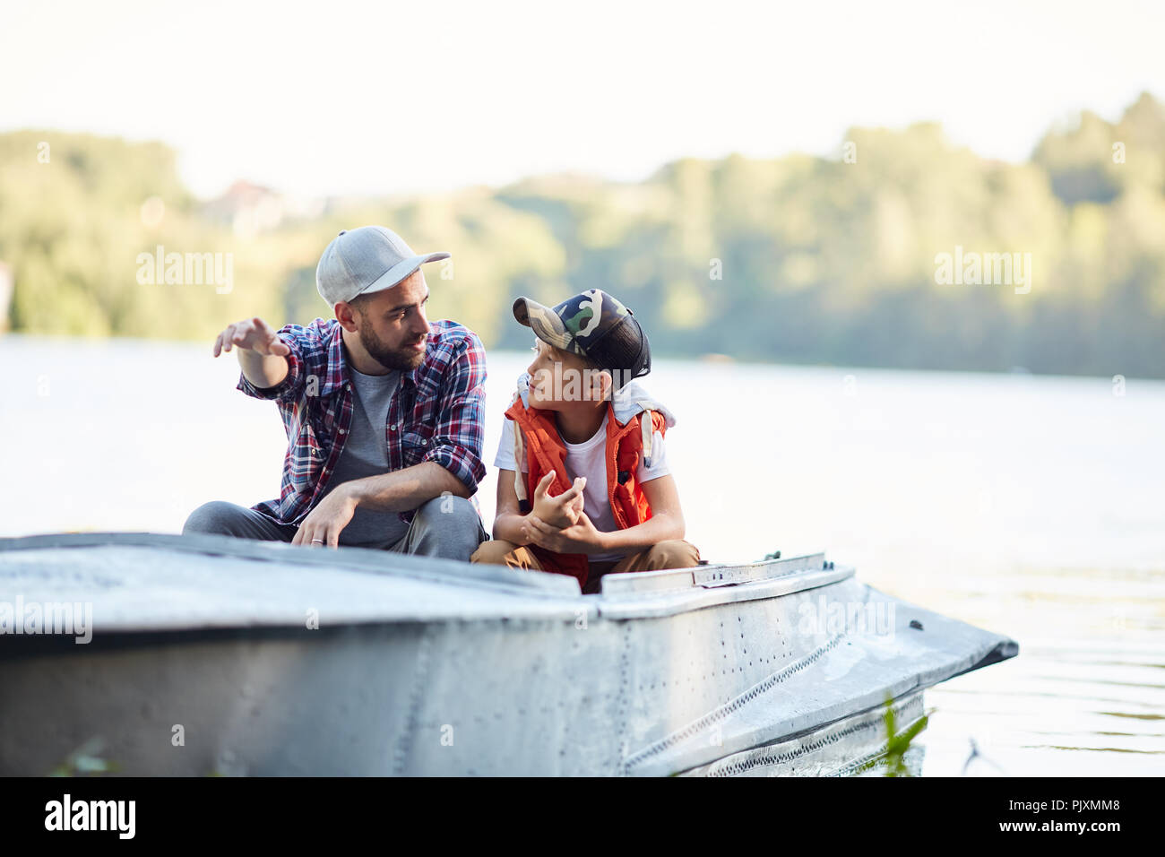 Boy pointing boat hi-res stock photography and images - Alamy