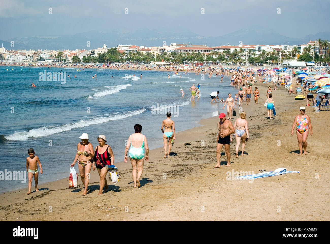 People walking along the beach, Spain Stock Photo - Alamy