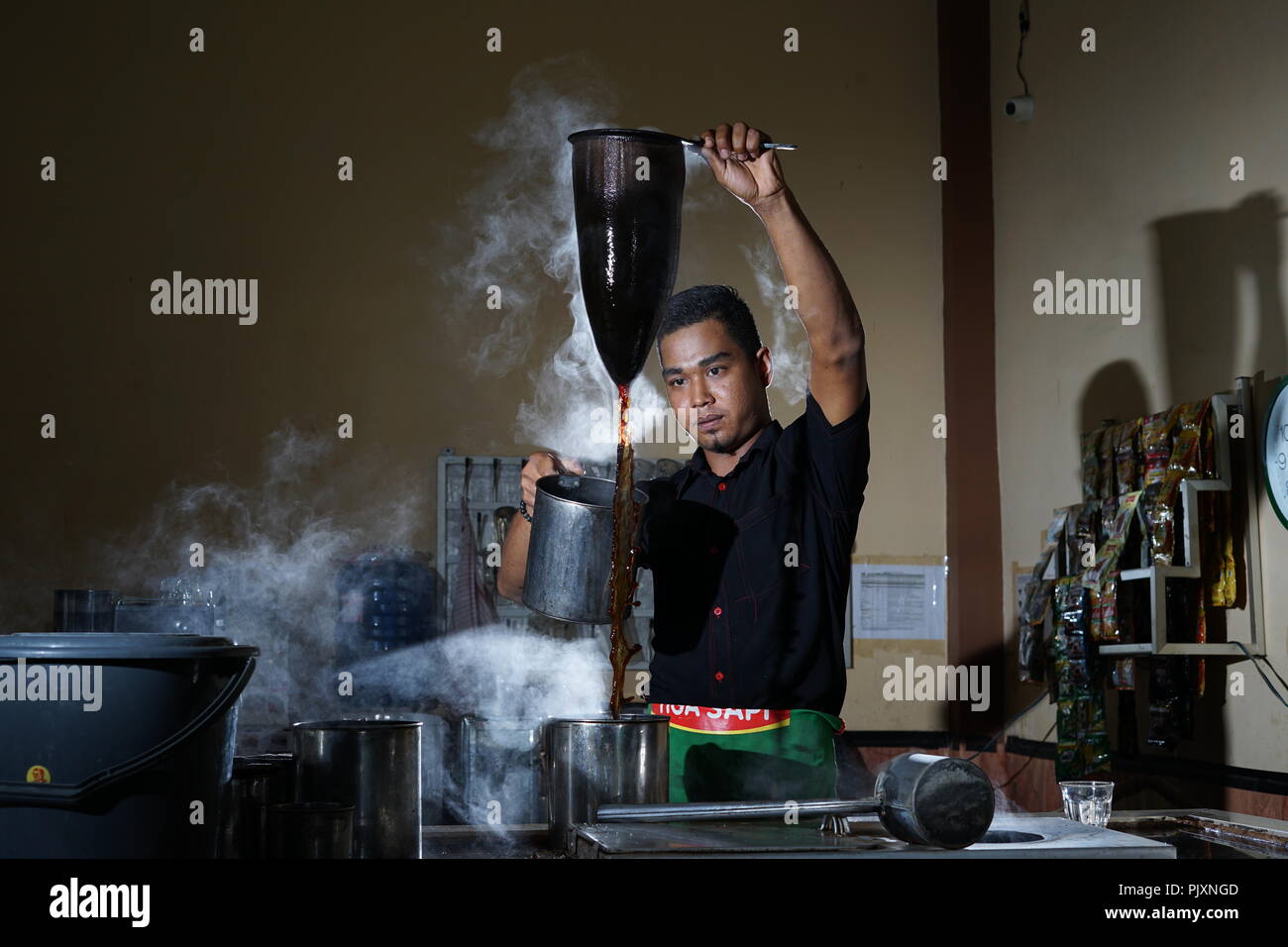 Traditional process of Aceh coffee making by Barista at Local Coffee ...