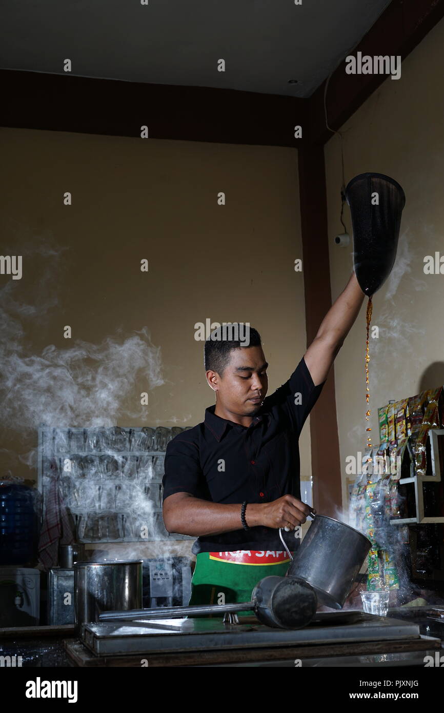 Traditional process of Aceh coffee making by Barista at Local Coffee ...