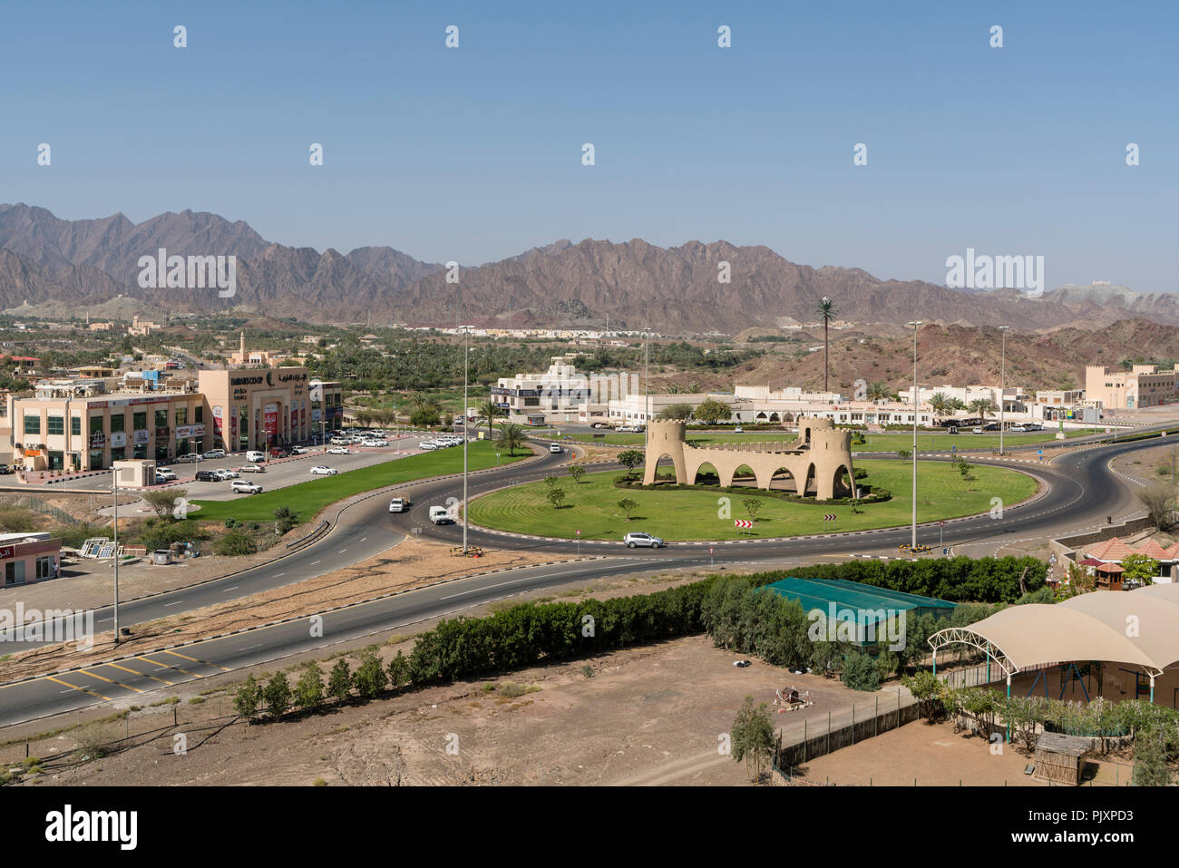 Roundabout on main Dubai-Hatta road with the main town of Hatta in the ...