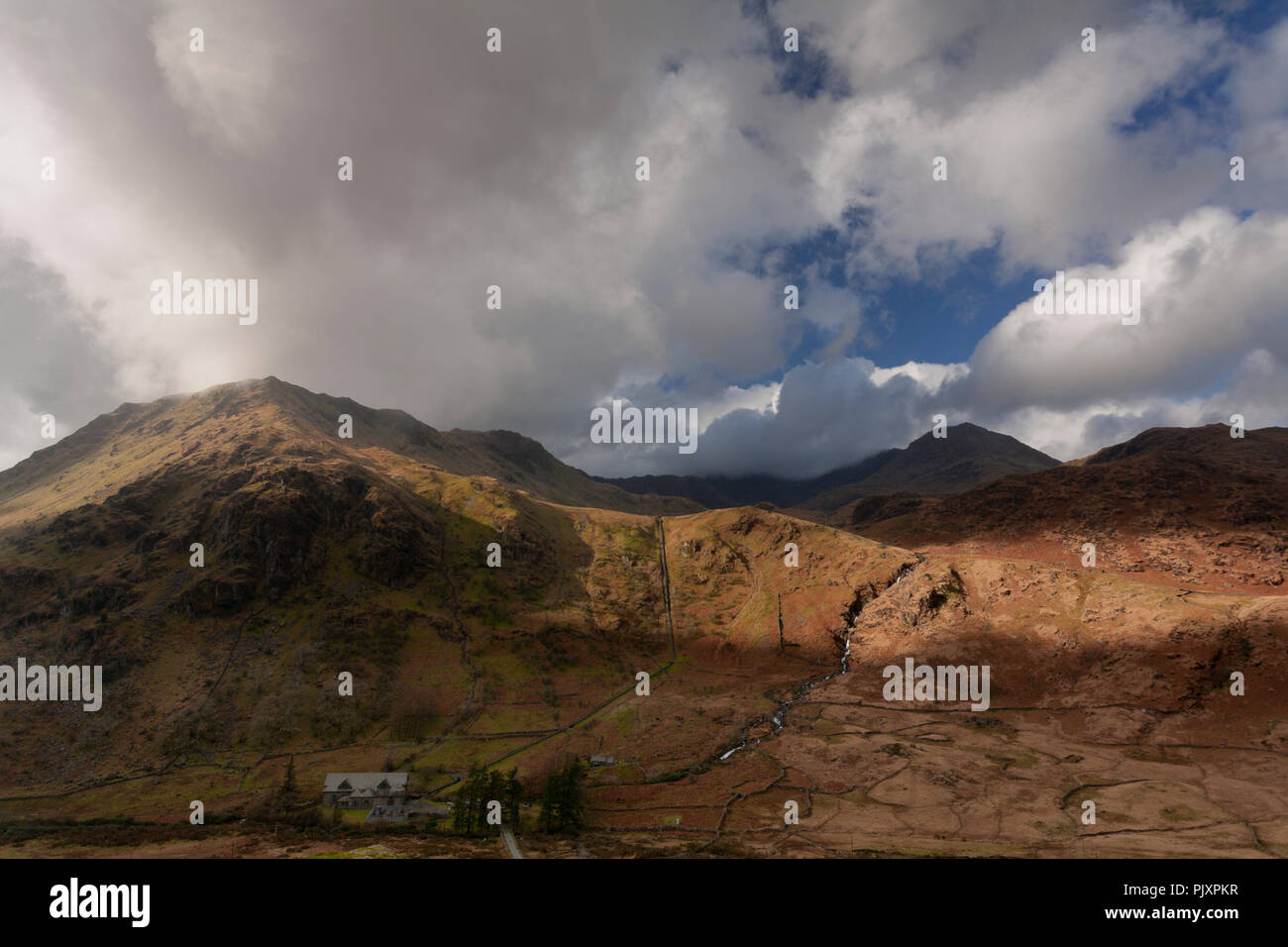Snowdon mountain and surrounding peaks under stormy skies, Snowdonia ...