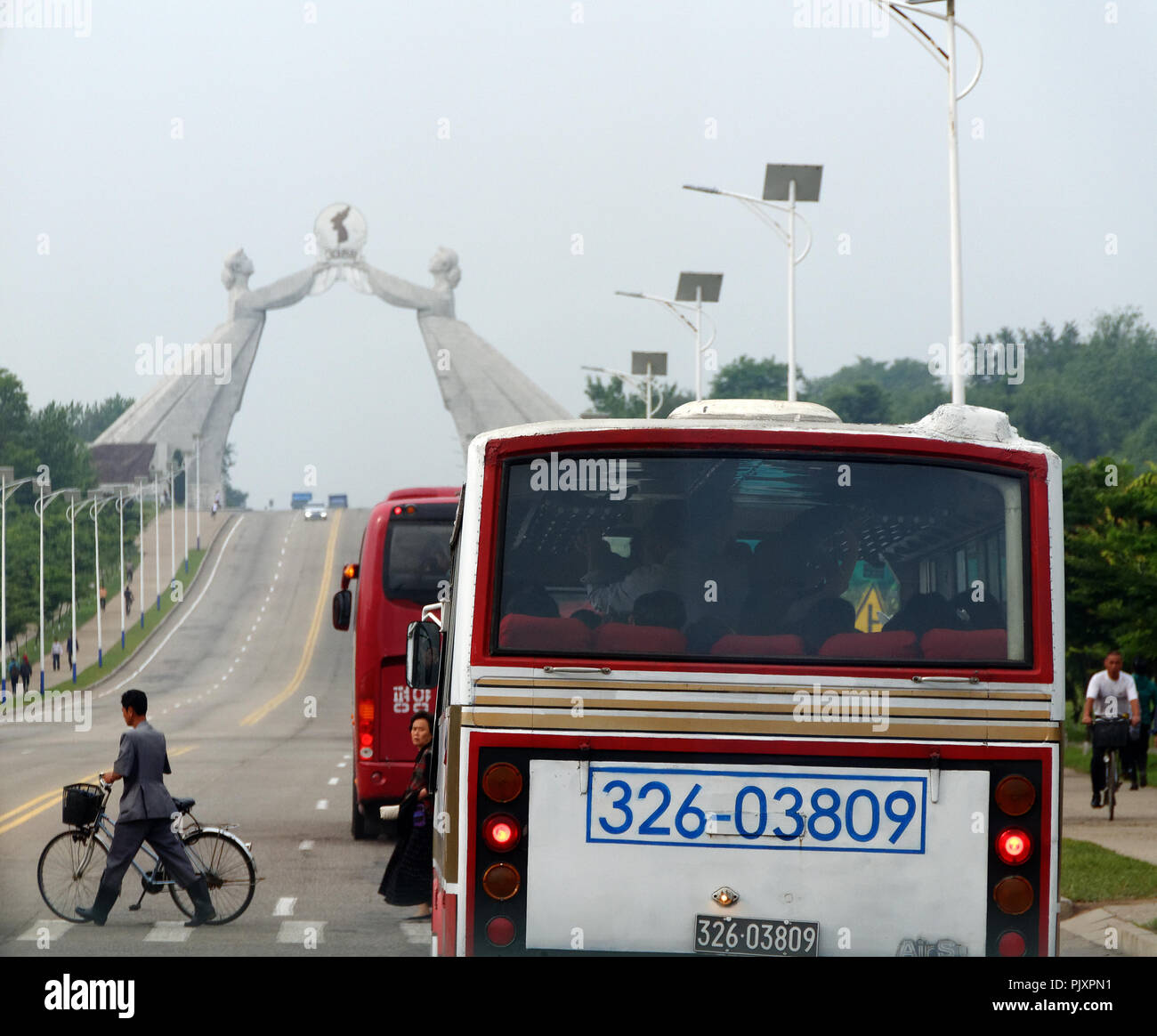 Tourist buses heading to the DMZ under The Arch of Reunification ...