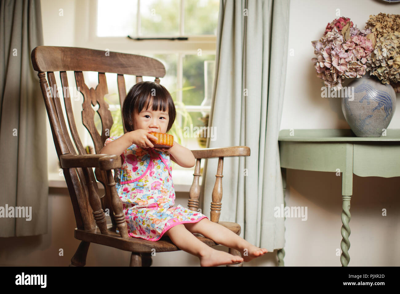 baby girl eating mooncake celebrating Chinese middle Autumn day Stock ...