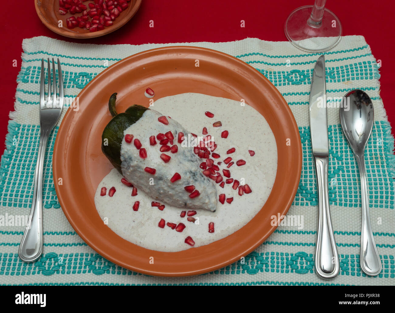 Chile en Nogada is a traditional mexican dish. Poblano pepper stuffed ...