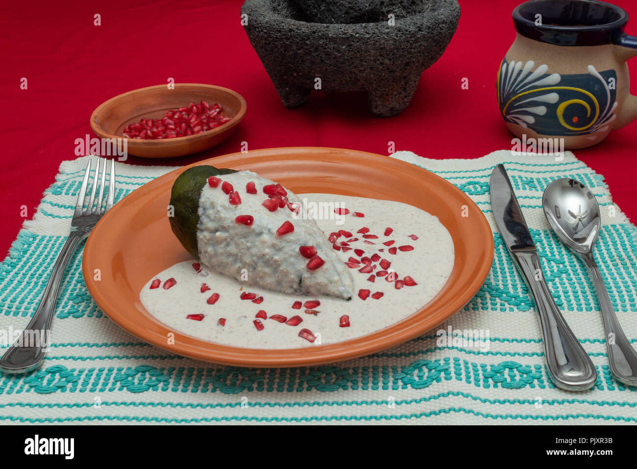 Chile en Nogada is a traditional mexican dish. Poblano pepper stuffed ...