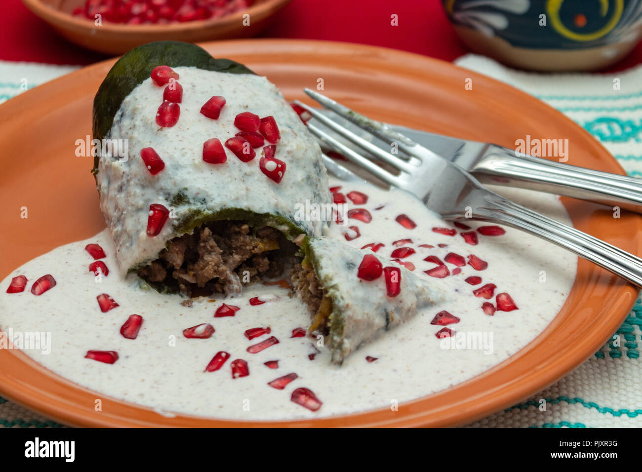 Chile en Nogada is a traditional mexican dish. Poblano pepper stuffed ...