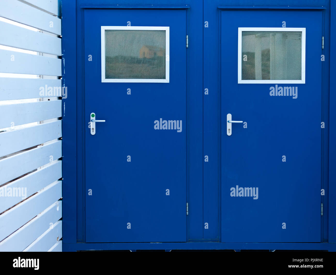 Colourful blue doors on entrances to seaside houses around Marzamemi ...