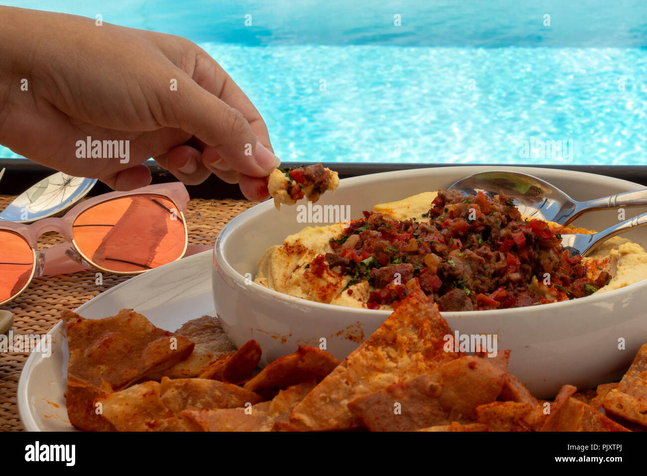 hummus by the pool. spicy snacs are tempting after swimming Stock Photo ...