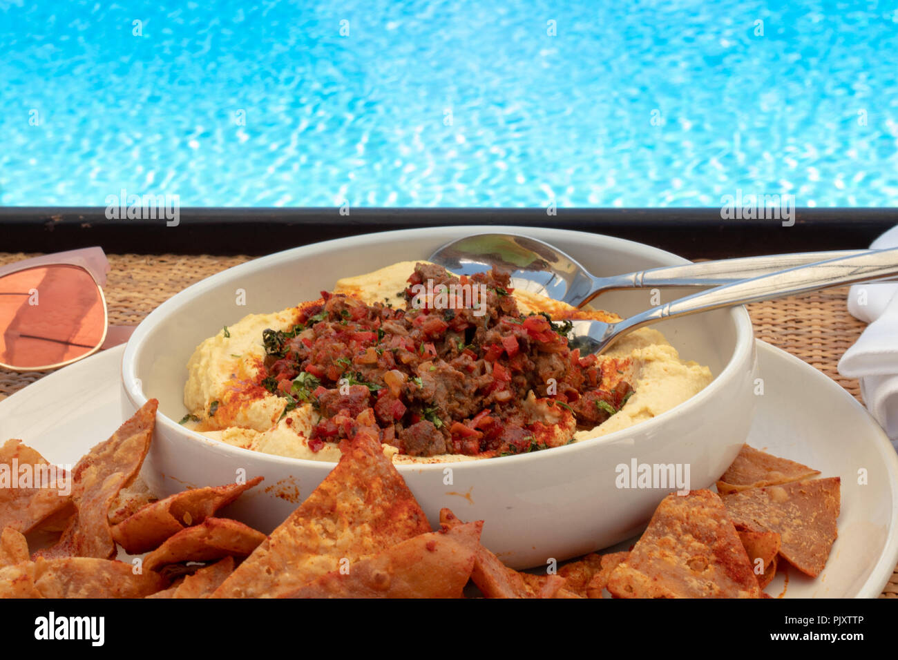 hummus by the pool. spicy snacs are tempting after swimming Stock Photo ...
