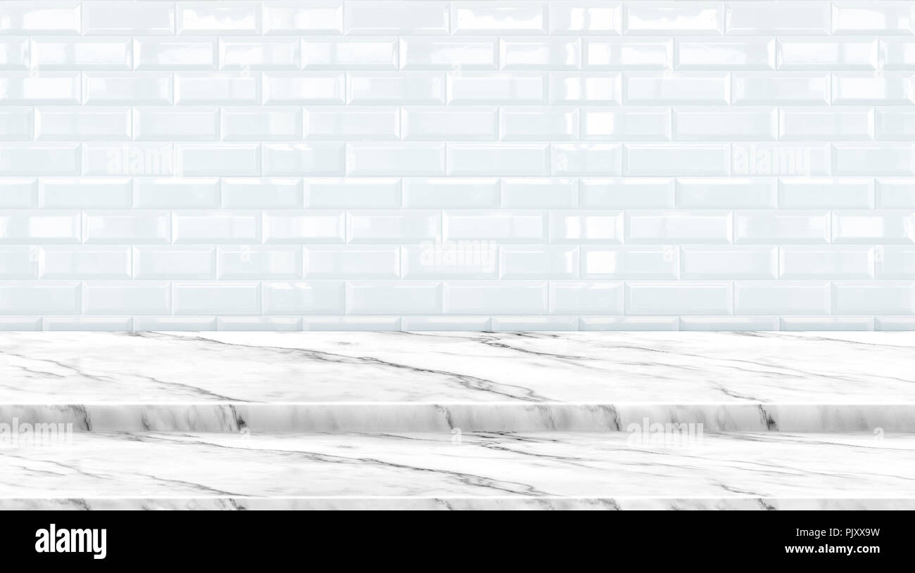Empty setp marble marble table top with white ceramic tile wall ...