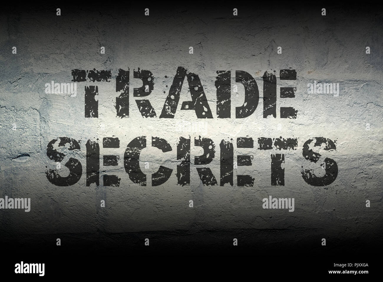 trade secrets stencil print on the grunge white brick wall Stock Photo ...