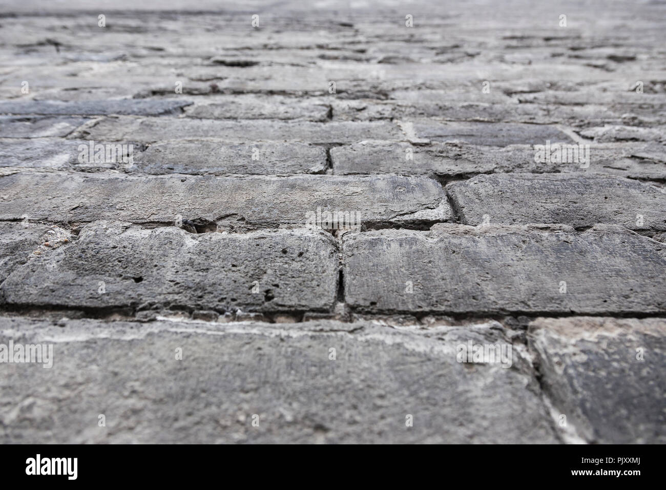 Old rustic gray stone brick wall, selective focus Stock Photo - Alamy