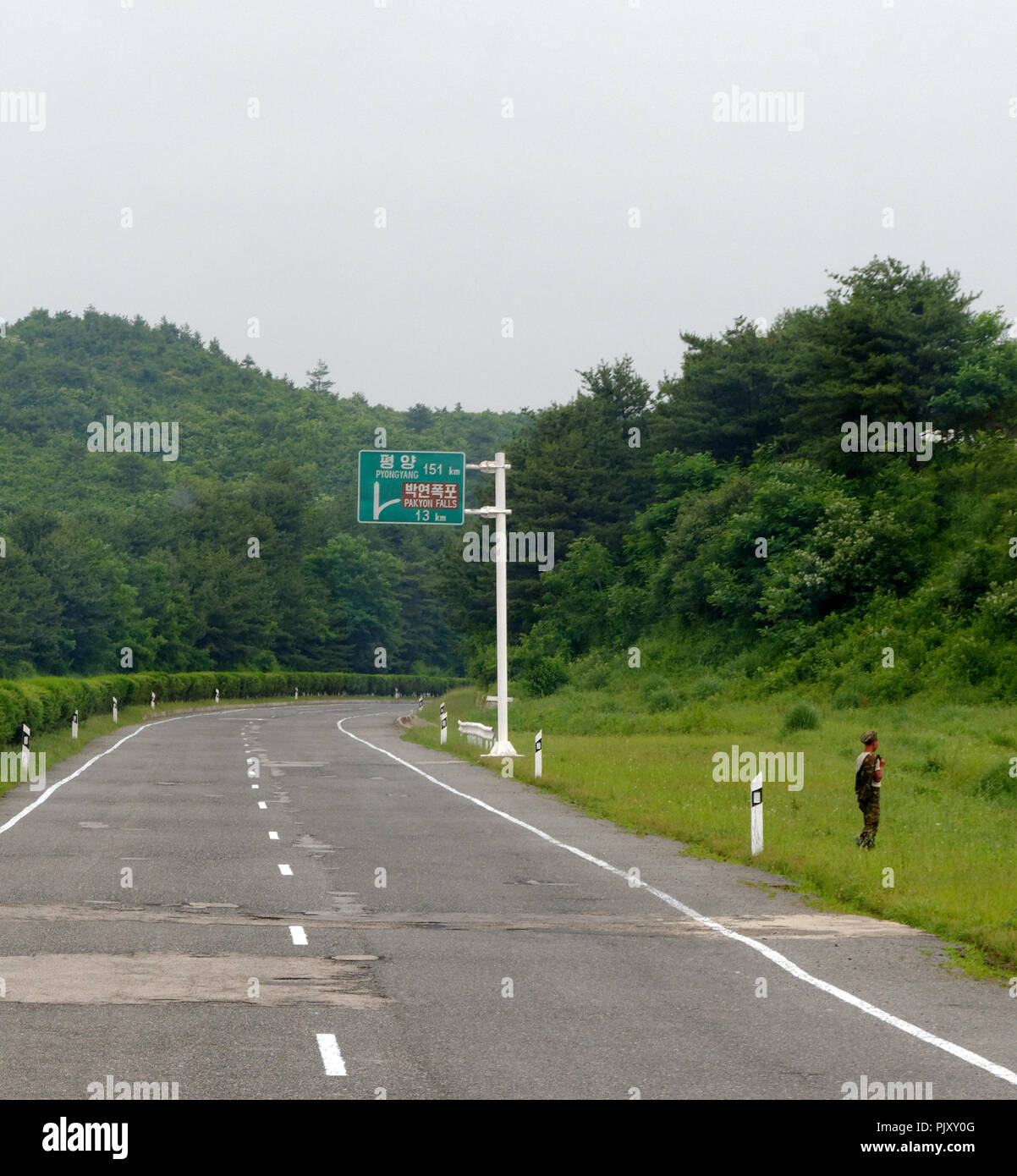Multi language traffic signs over empty roads in North Korea Stock ...