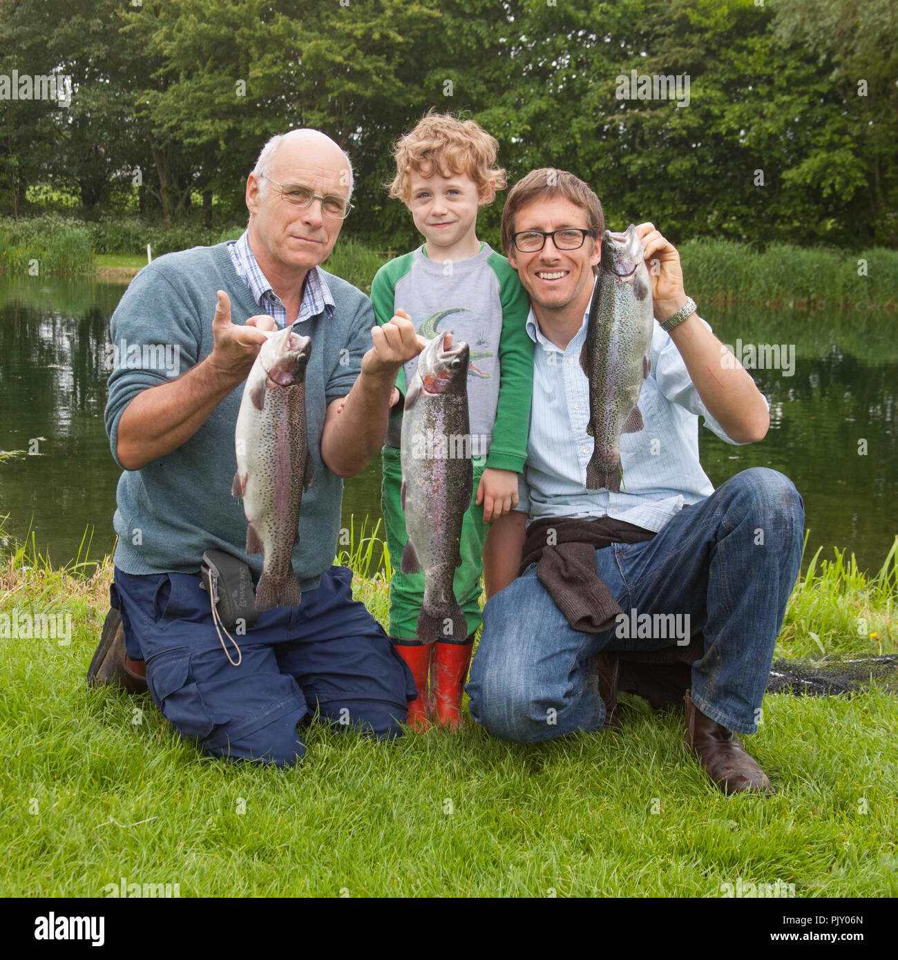Three generation of fishermen at Meon Springs Trout Fishery, Hampshire ...