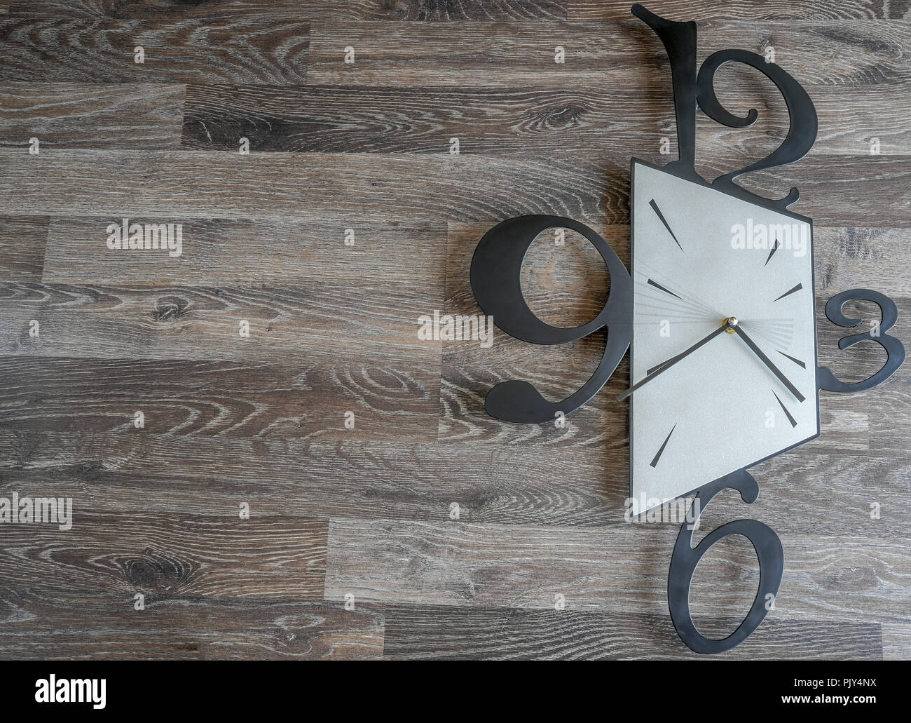 Wall clock with prominent numbers three, six, nine and twelve Stock ...