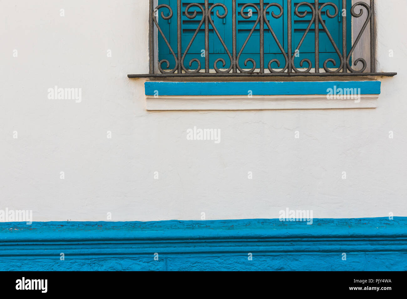 full frame shot of a traditional moroccan window painted in blue ...