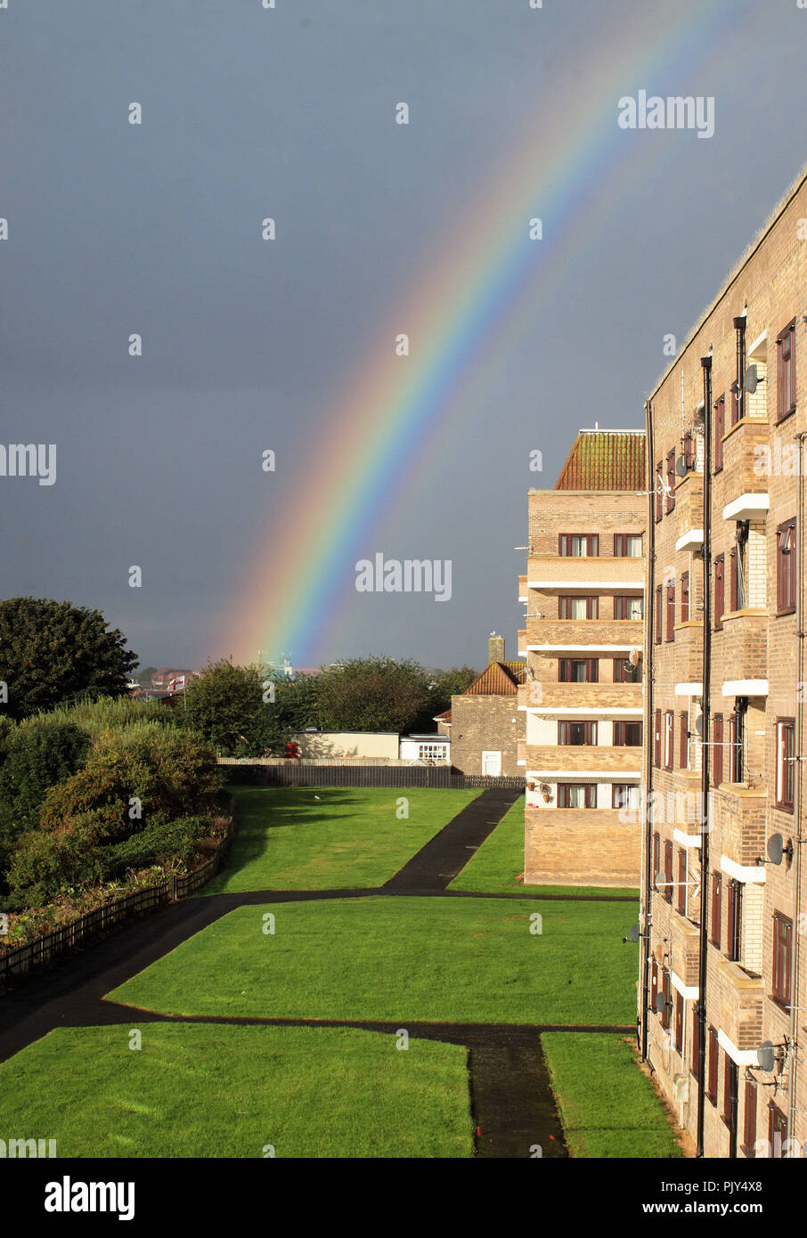 A rainbow arcking over 'Sir John Knott Memorial Flats' on the banks of ...