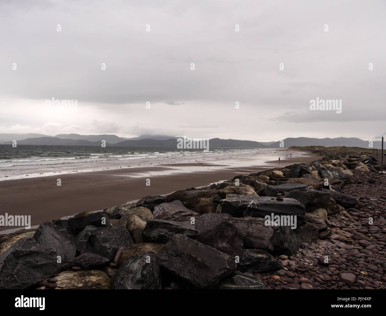 Rossbeigh beach in Ireland on a rainy day with greey clouds Stock Photo ...