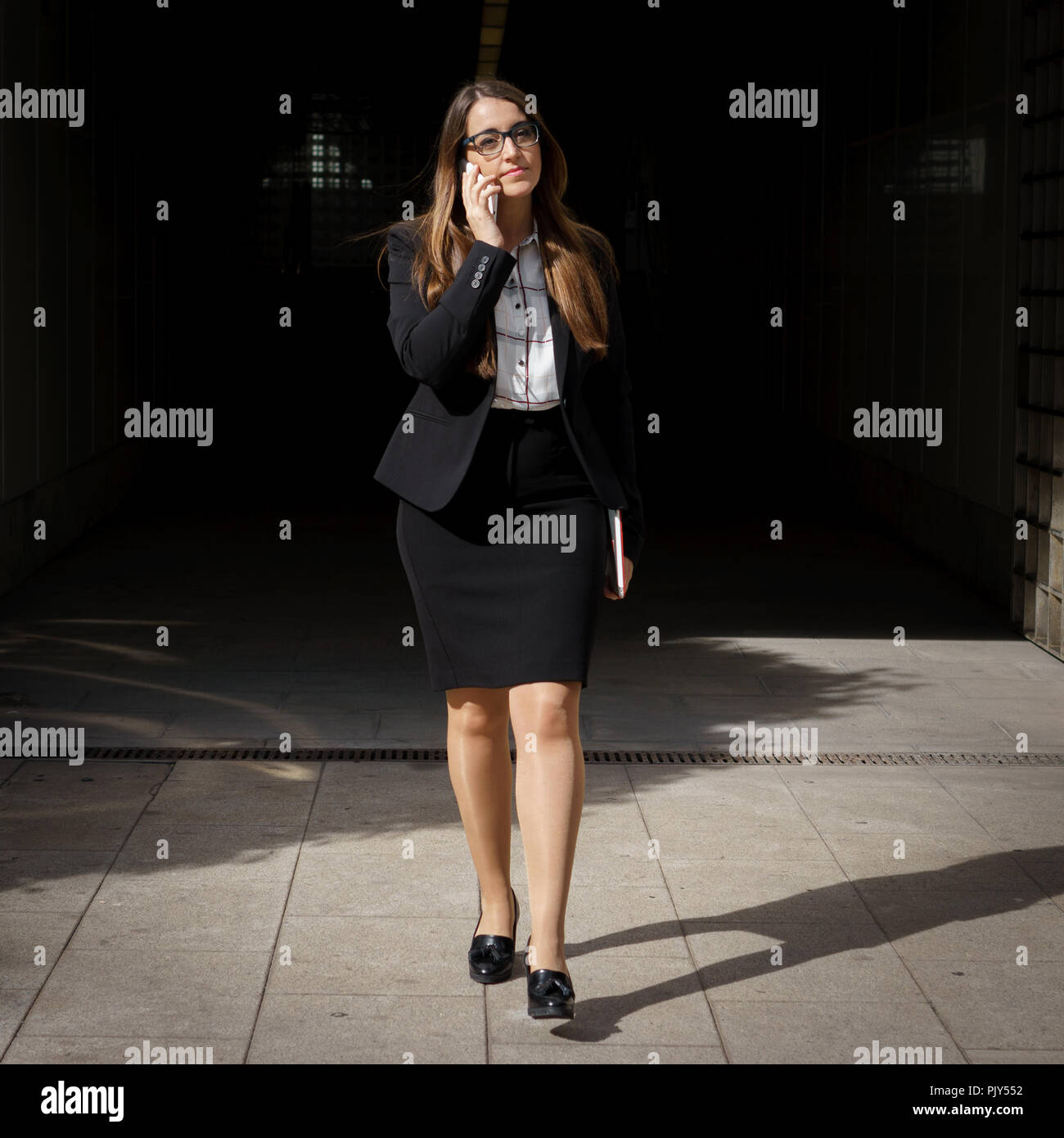 Tunnel walking away woman hi-res stock photography and images - Alamy