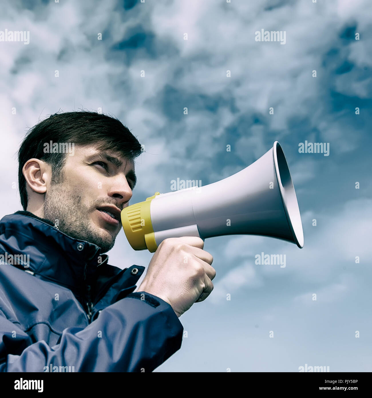 Person speaking megaphone in march hi-res stock photography and images ...
