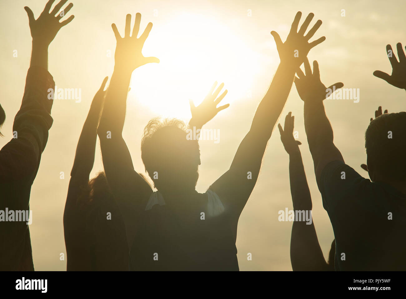 Hands up outdoor, back view Stock Photo - Alamy
