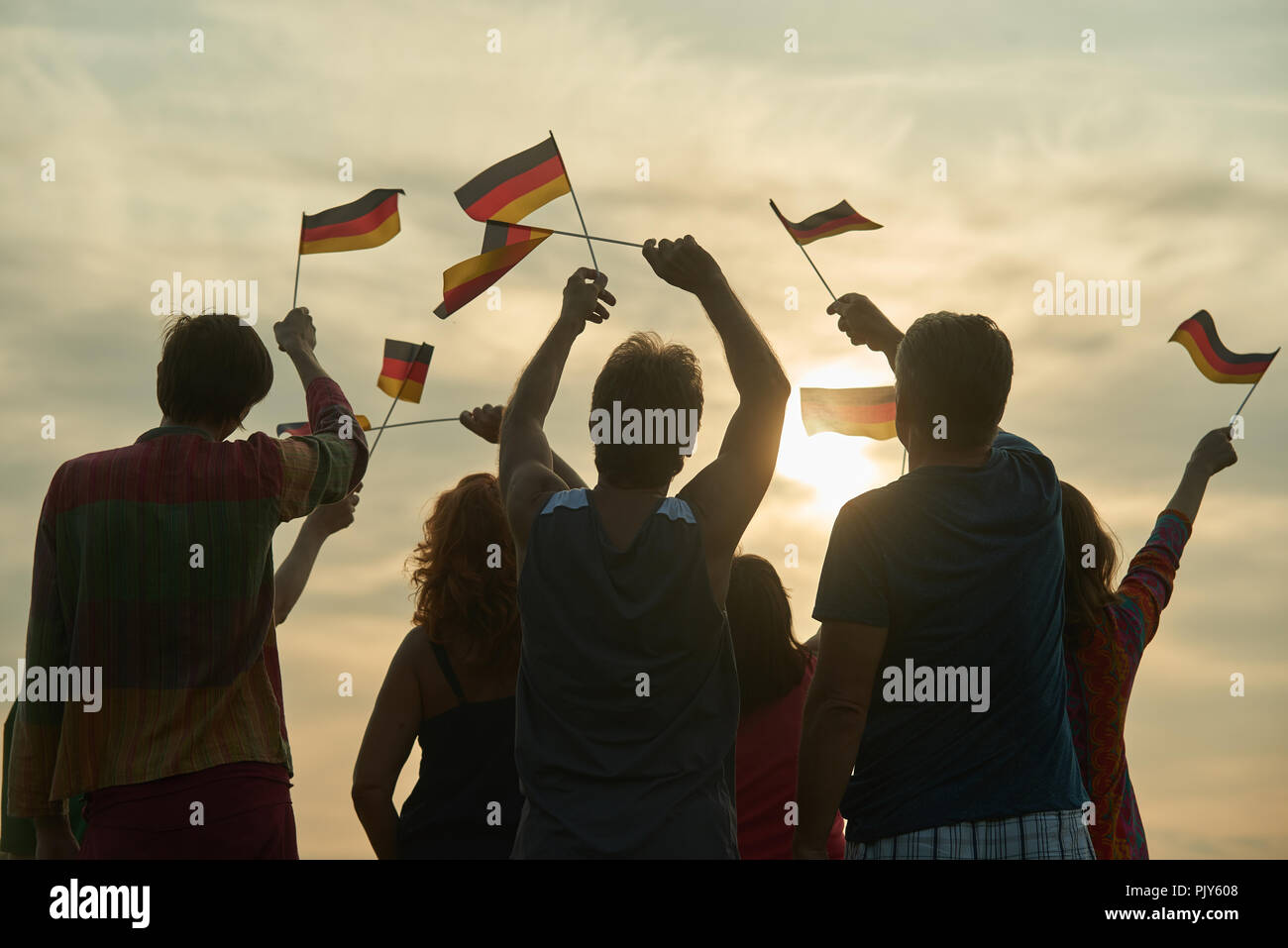 Group of people waving deutch flags Stock Photo - Alamy