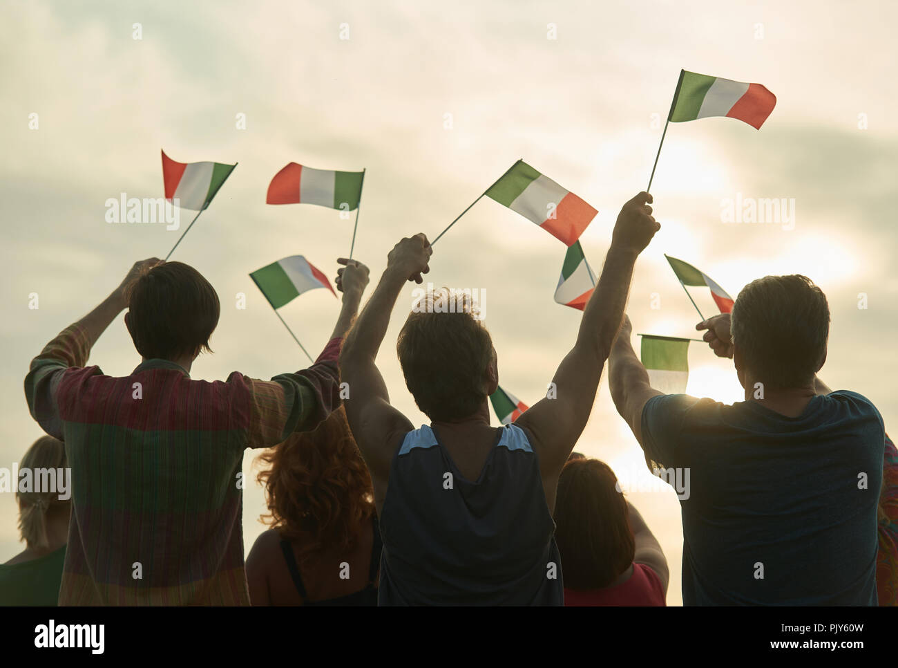 Group of people waving italian flags Stock Photo - Alamy