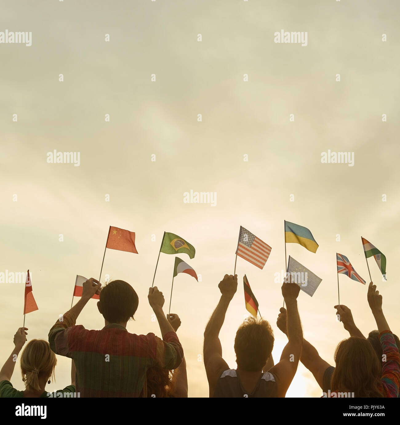 Group of people waving country flags Stock Photo - Alamy