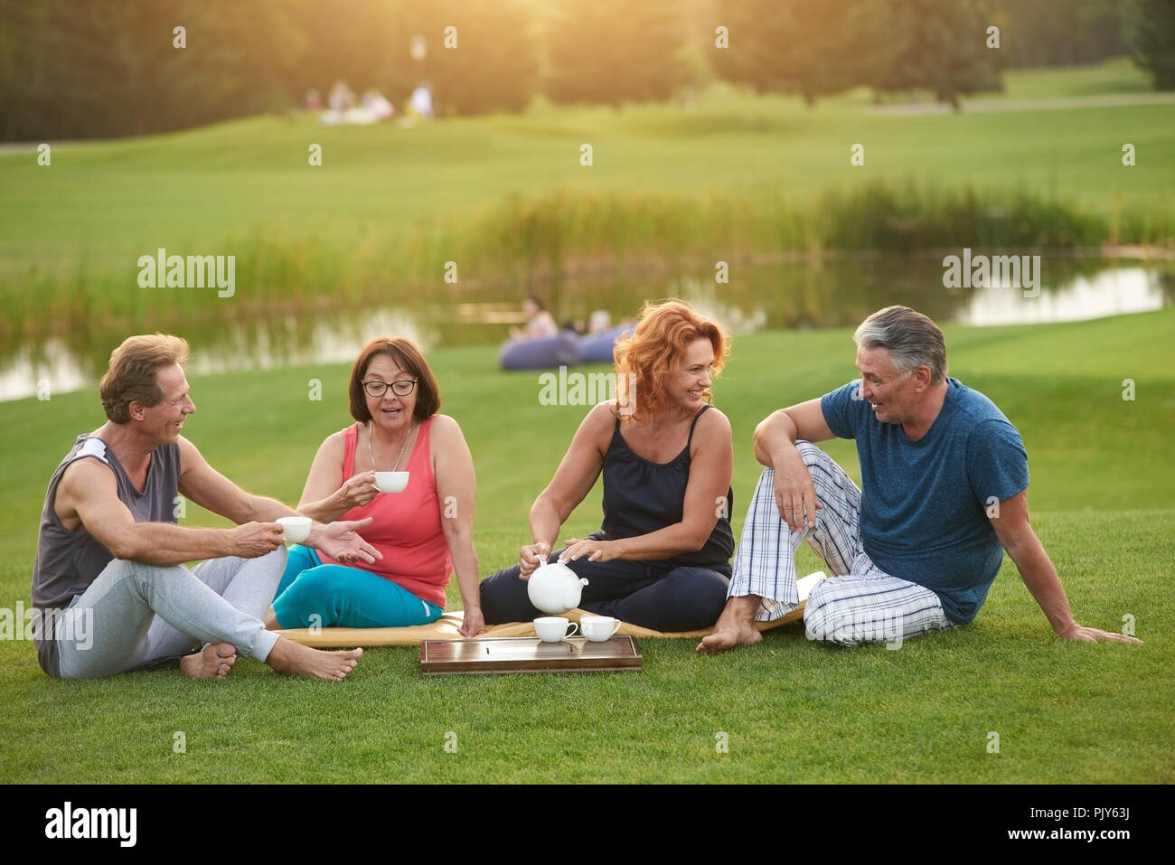 Drinking tea and talking outdoor Stock Photo - Alamy