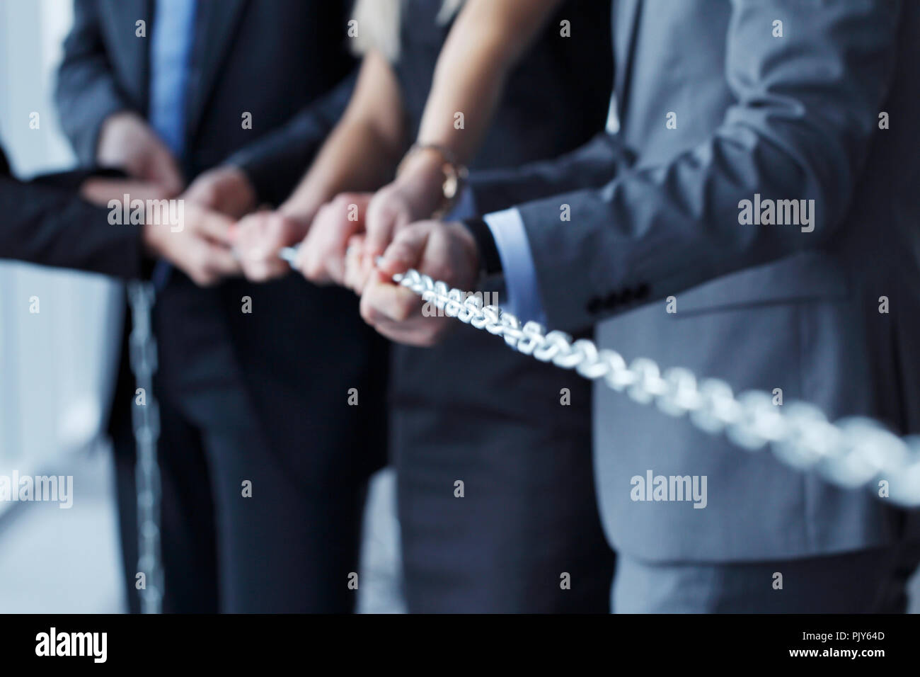 Businessmen pulling chain, teamwork togetherness concept Stock Photo ...