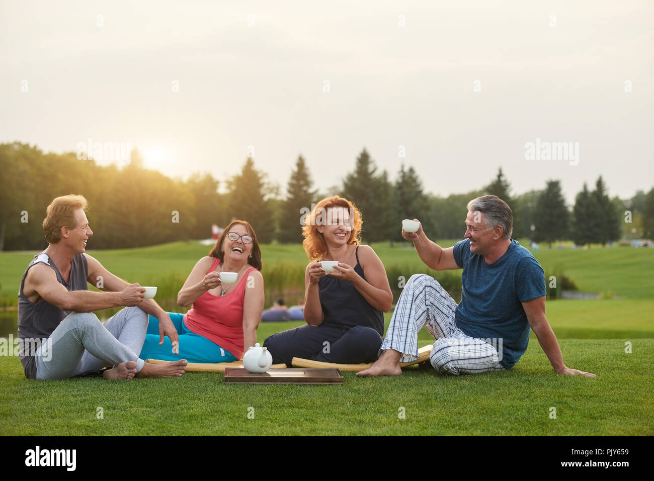Happy people laughing coffee outside hi-res stock photography and ...