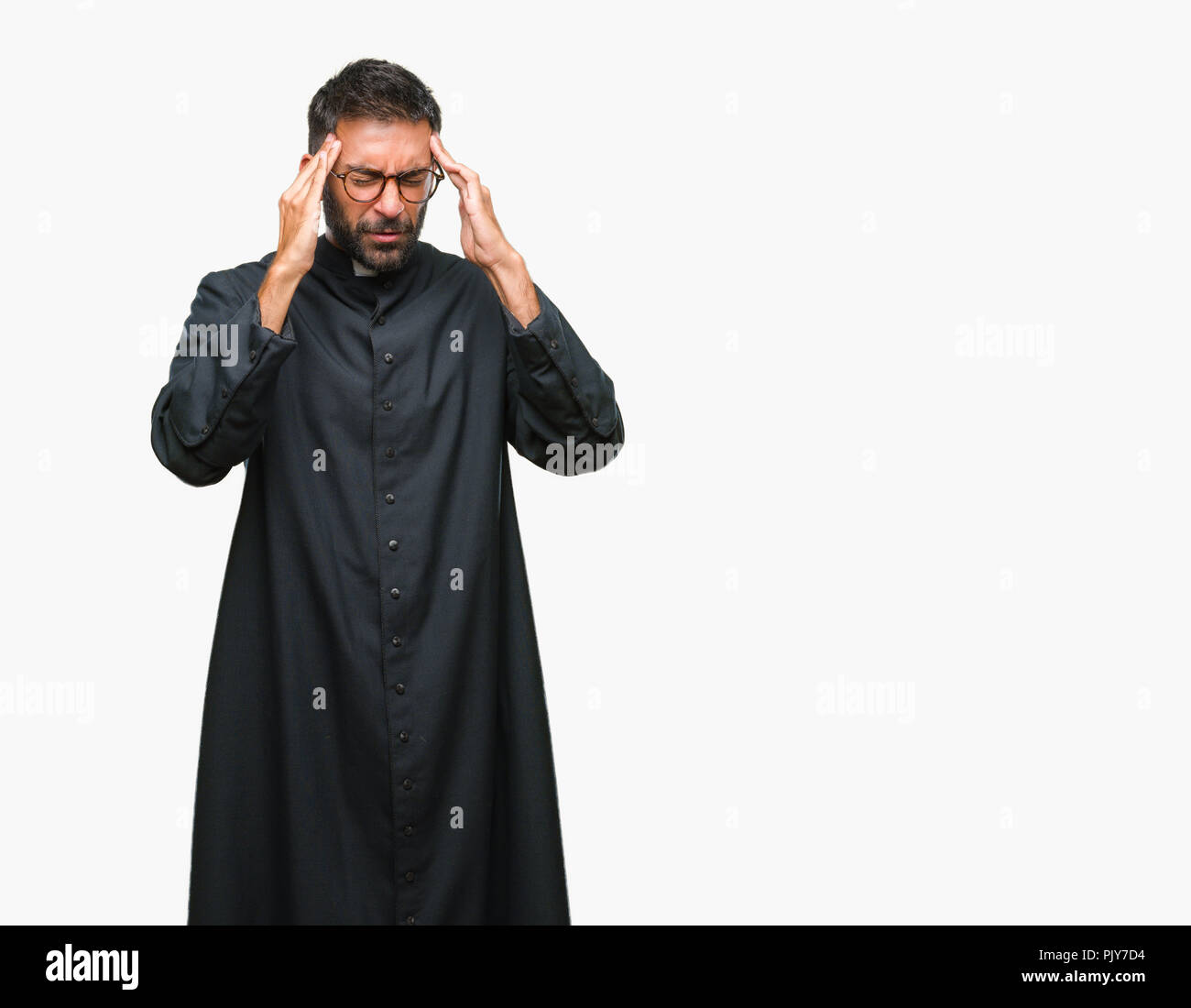 Adult hispanic catholic priest man over isolated background with hand ...