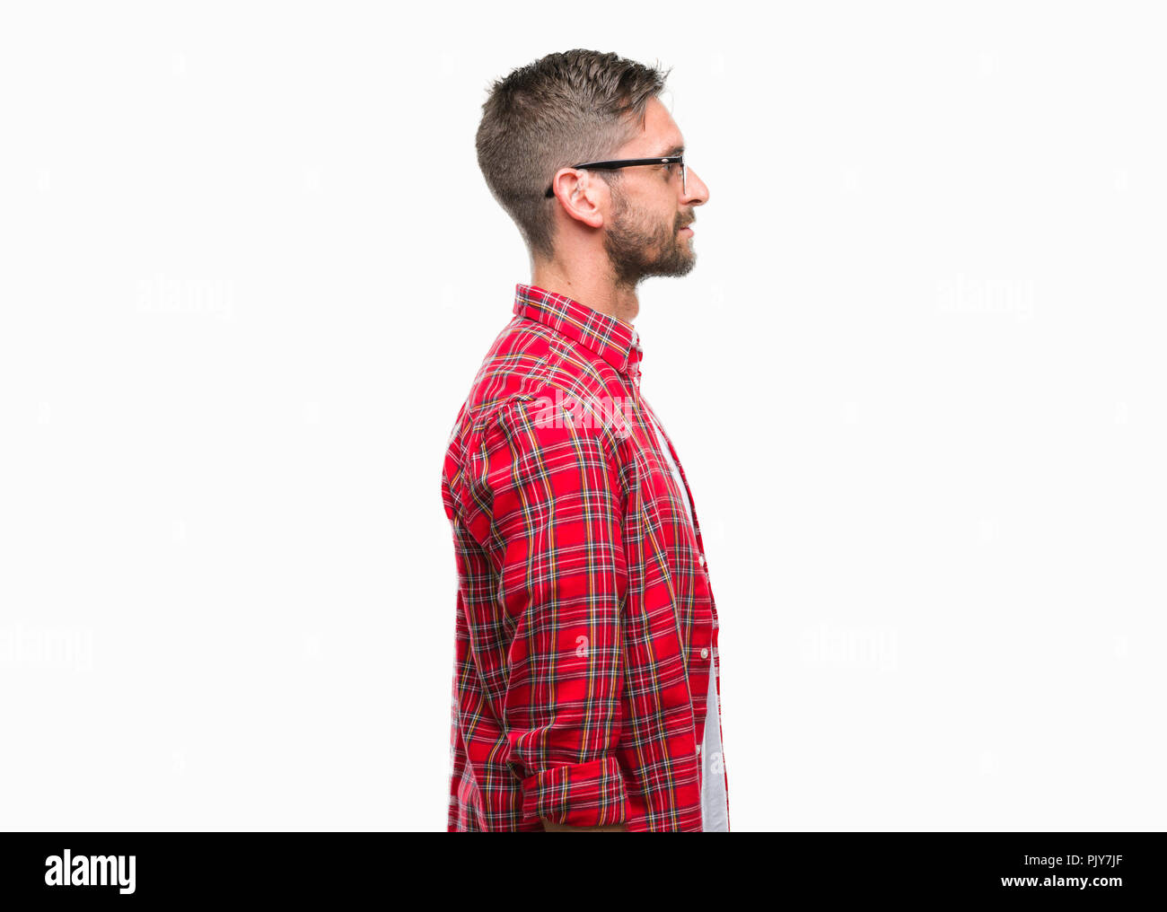 Young handsome man over isolated background looking to side, relax ...
