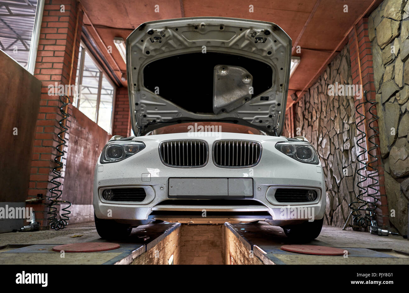 white car in the service station Stock Photo - Alamy