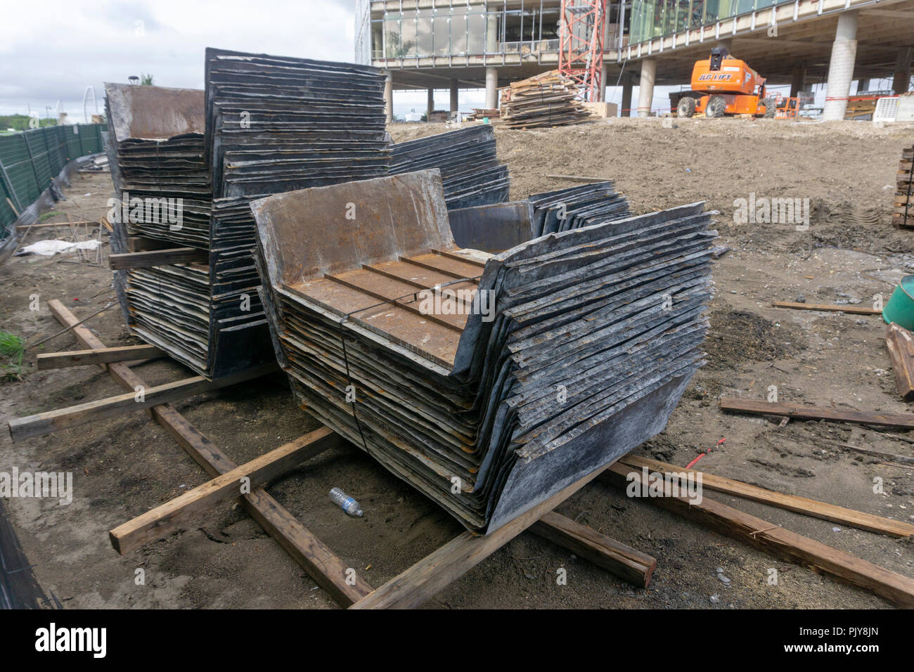 Stacked materials on a construction site Stock Photo - Alamy