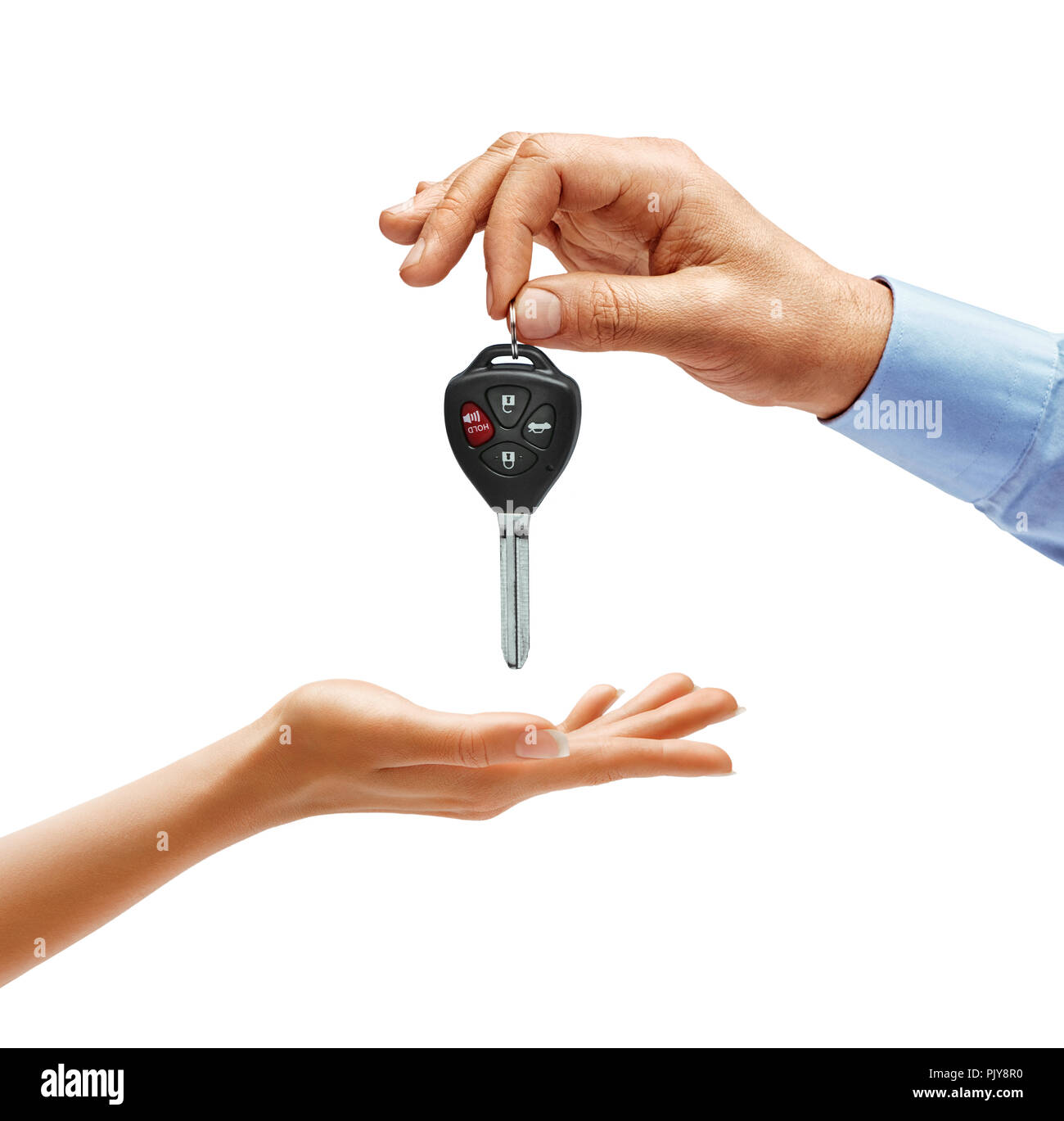 Man's hand giving the car key to woman's hand isolated on white ...