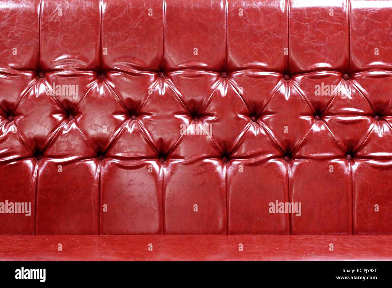 red sofa leather as background or texture Stock Photo - Alamy